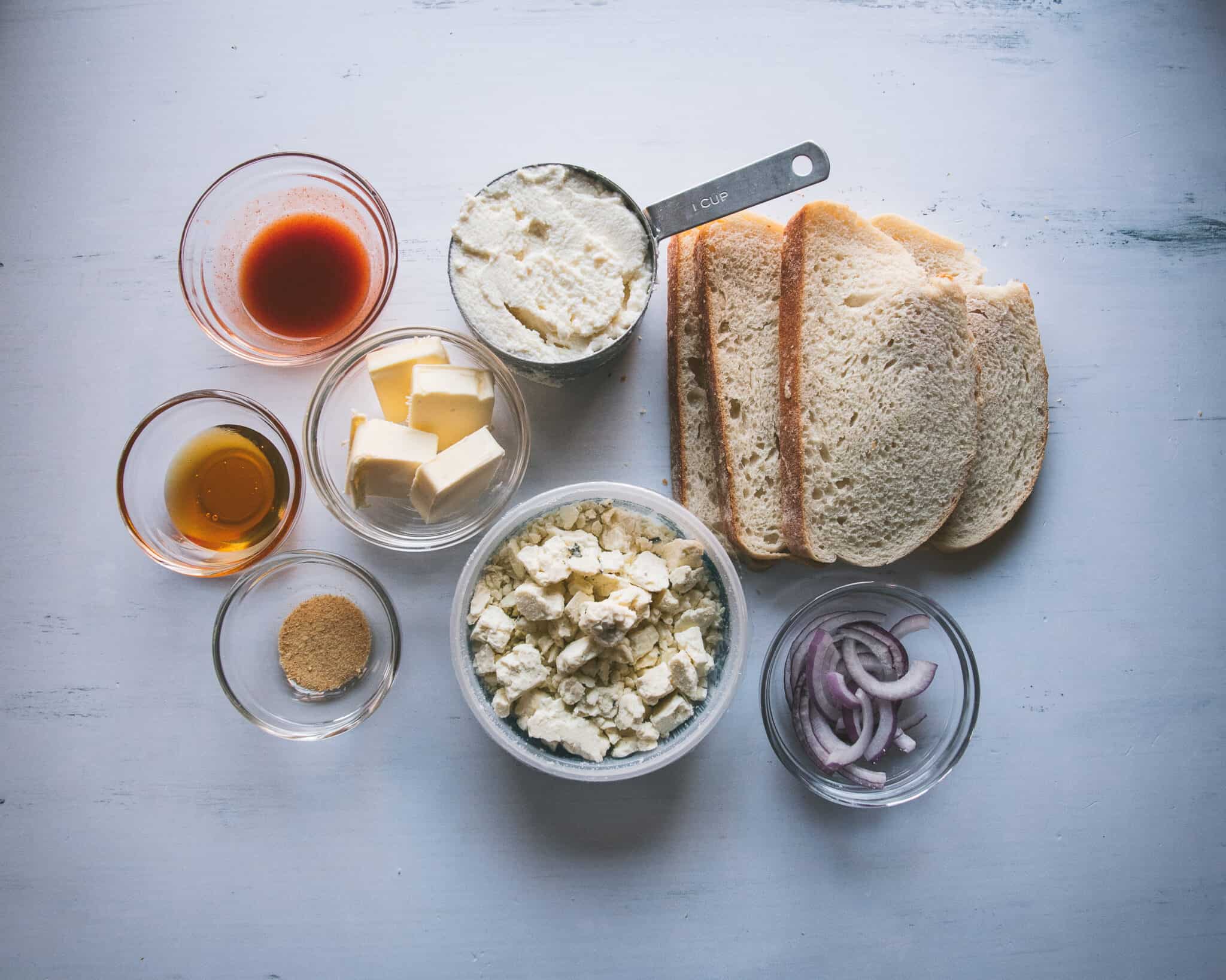 Buffalo Sauce Toasts with Whipped Bleu Cheese